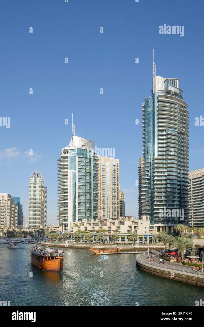 Dubai Marina is a man-made waterfront district with skyscrapers, luxury ...