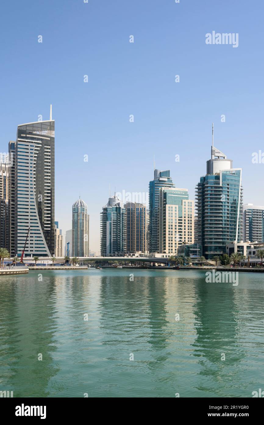 Dubai Marina is a man-made waterfront district with skyscrapers, luxury ...