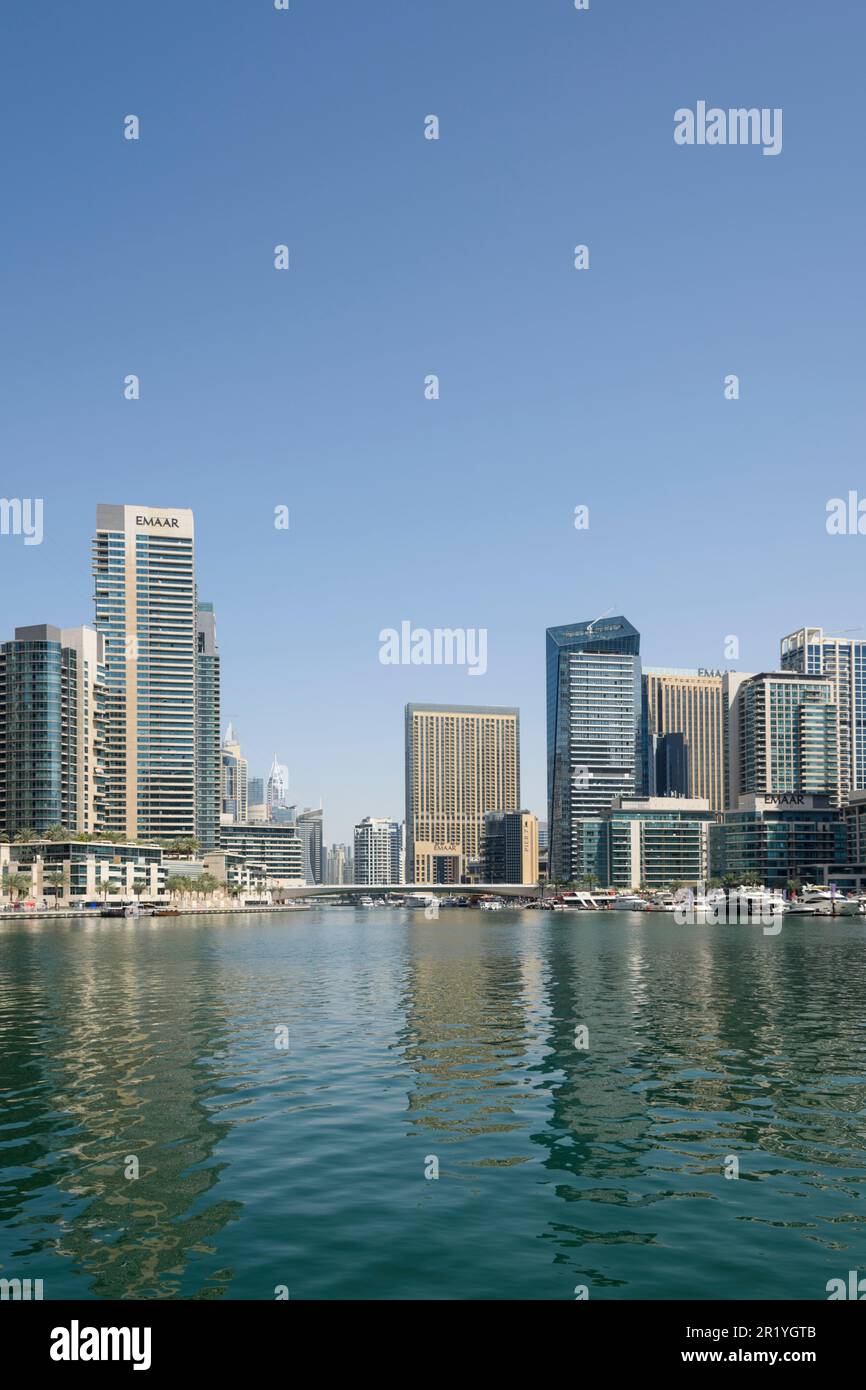 Dubai Marina is a man-made waterfront district with skyscrapers, luxury ...