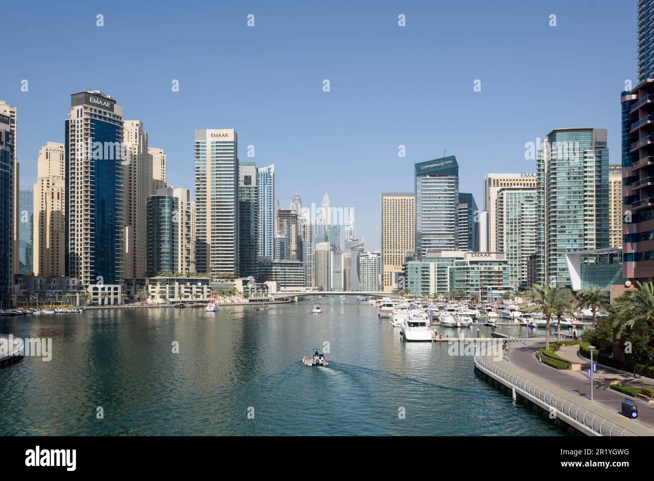 Dubai Marina is a man-made waterfront district with skyscrapers, luxury ...