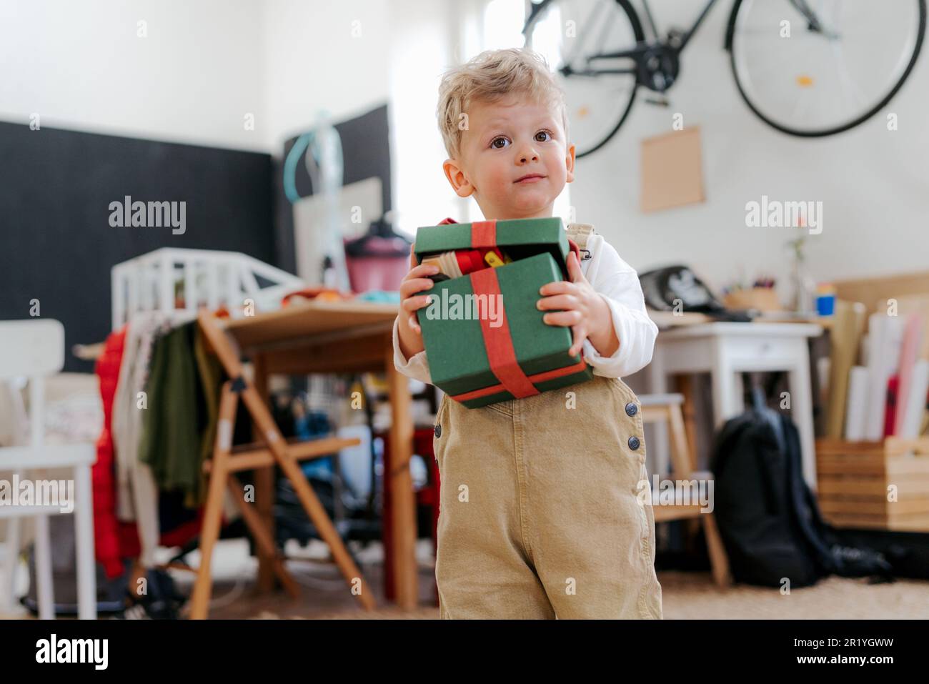 Child getting present christmas hi-res stock photography and images - Alamy