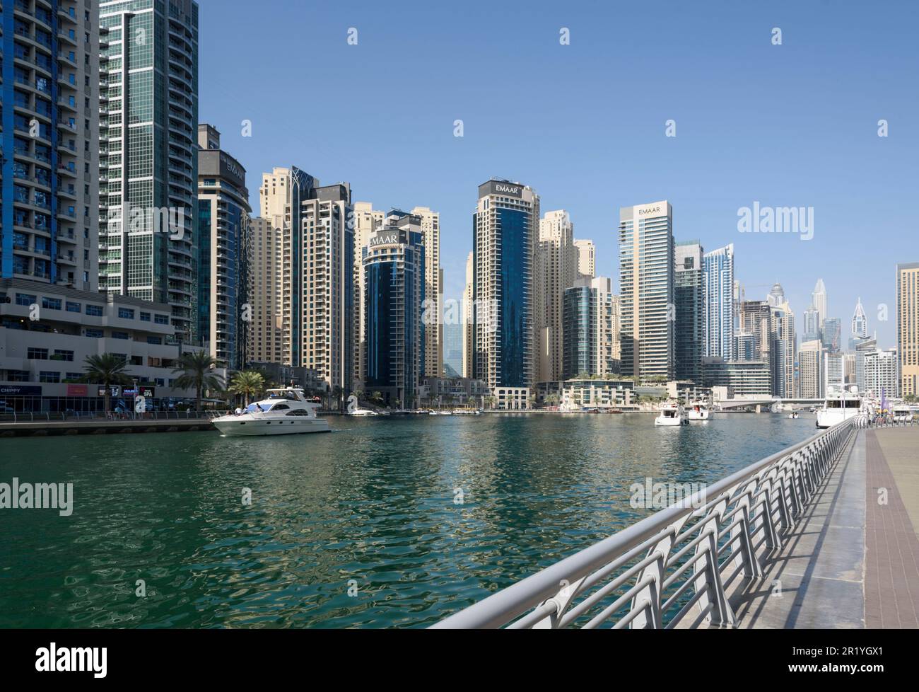 Dubai Marina is a man-made waterfront district with skyscrapers, luxury ...