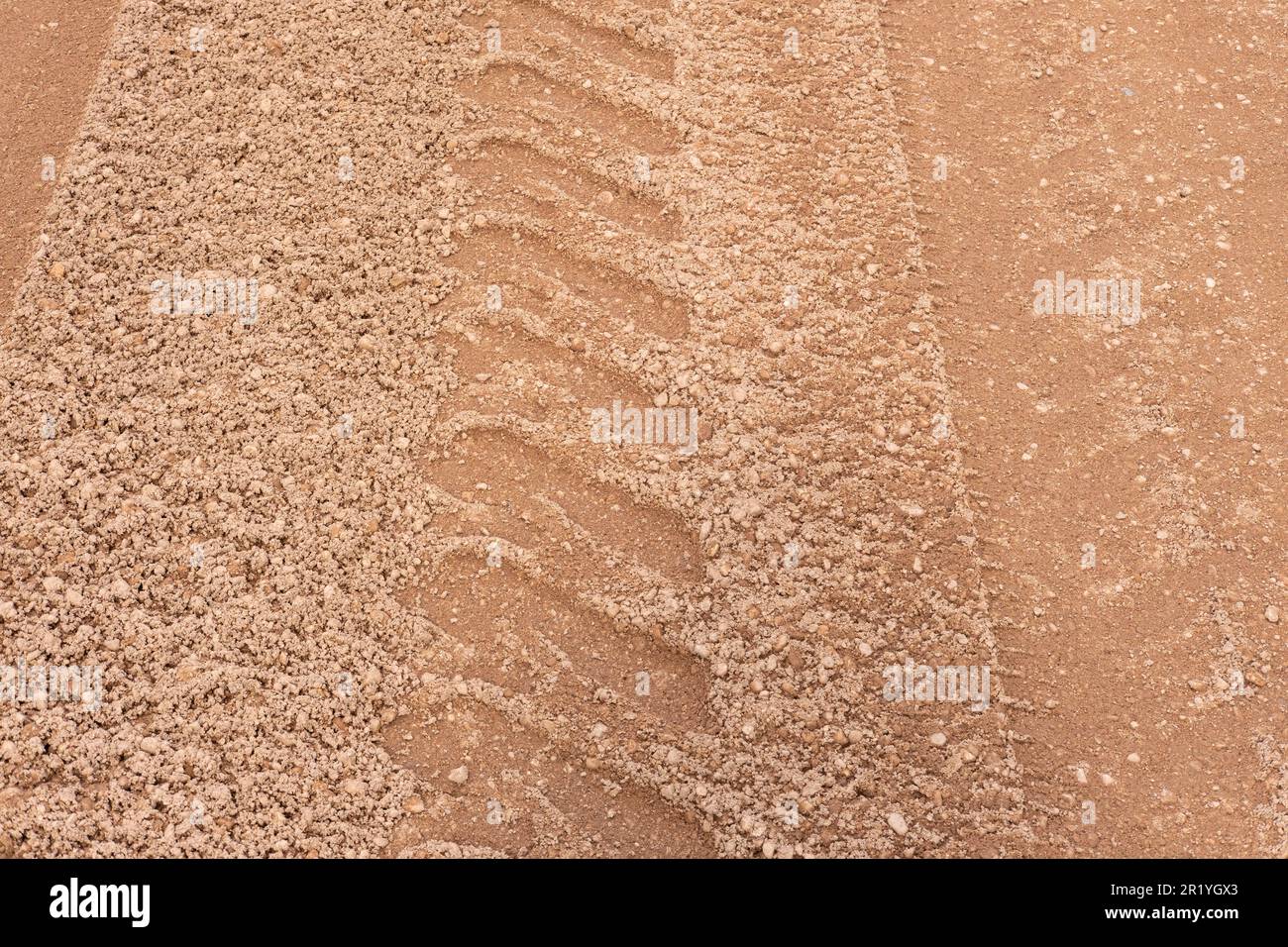 Footprint of car tire tread in a sand gravel road texture. Country road ...