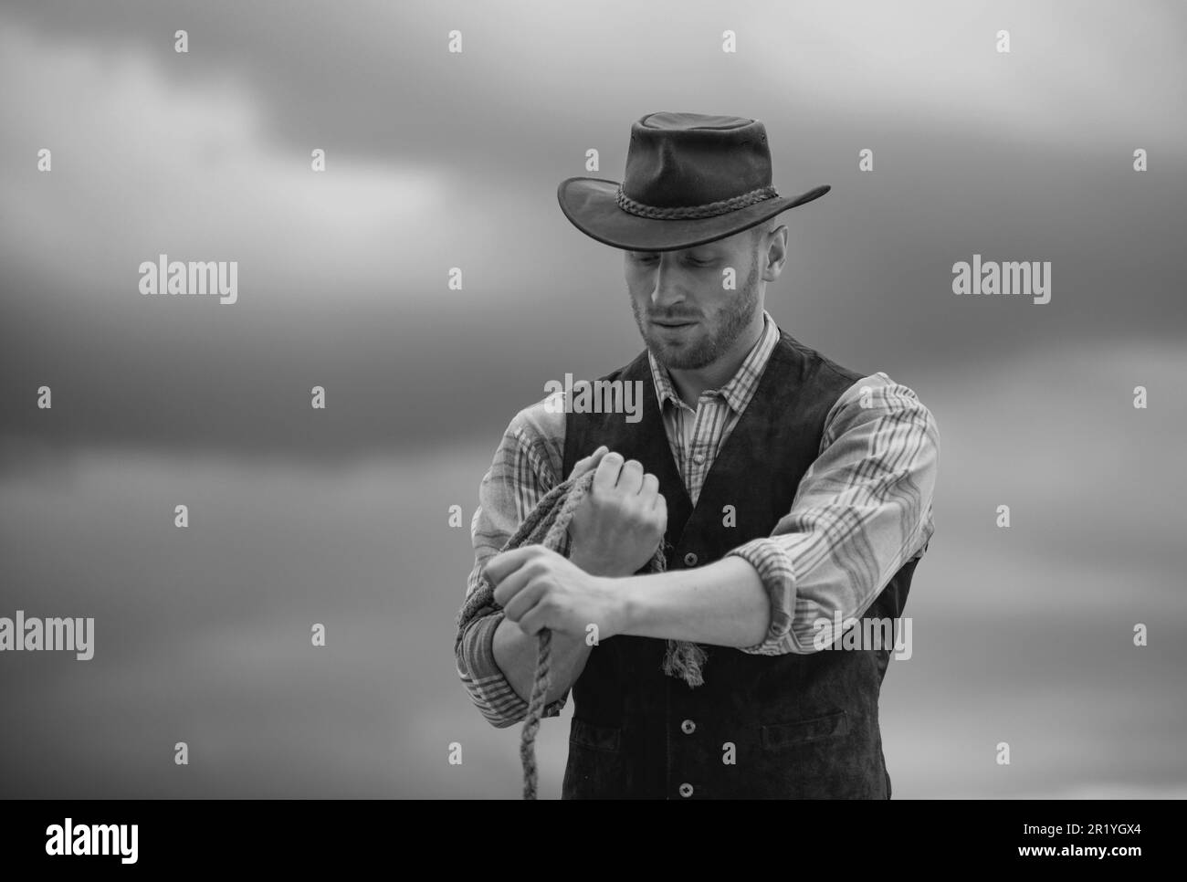 Cowboy farmer man in country side wearing western cowboy hat. American ...
