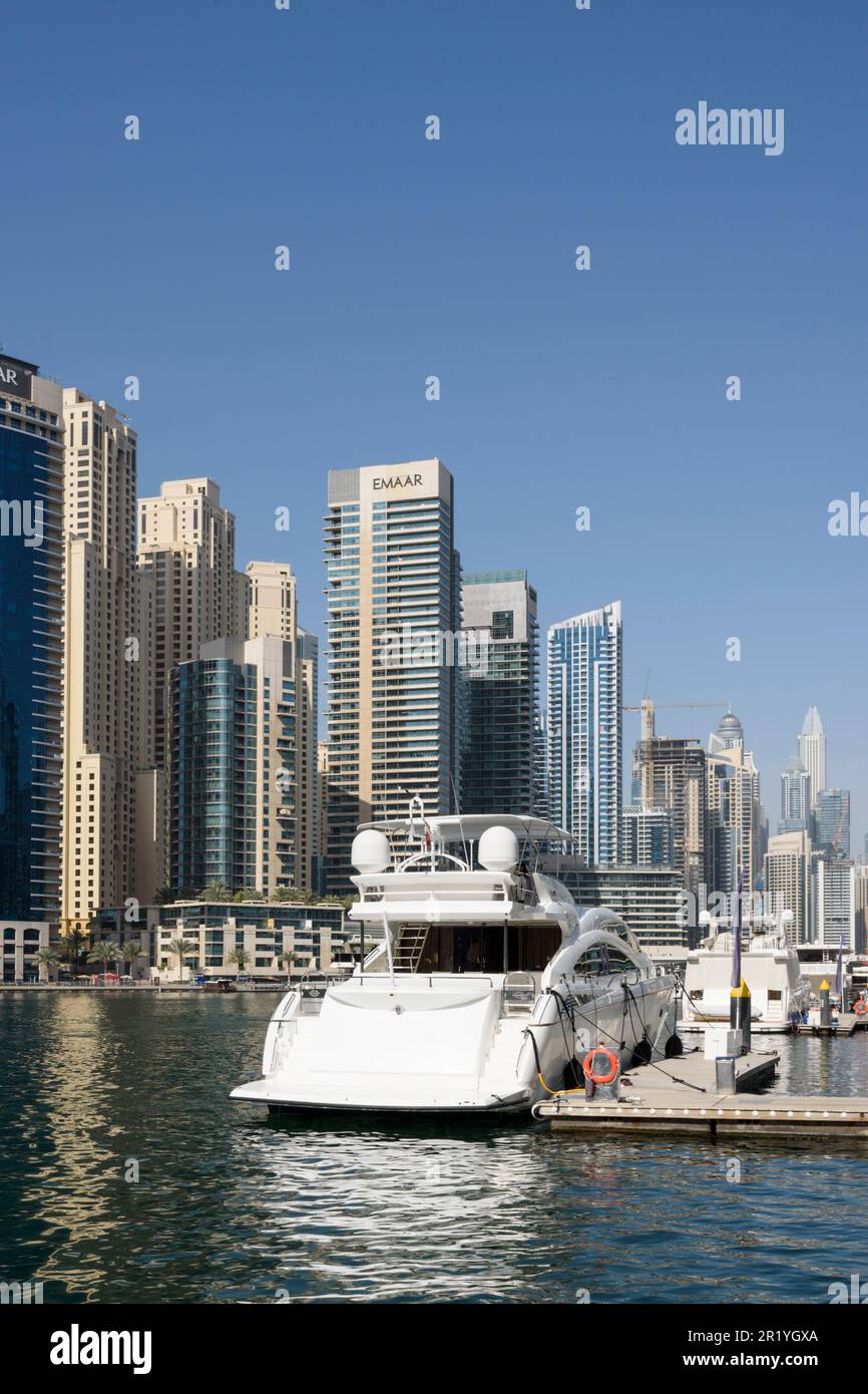 Dubai Marina is a man-made waterfront district with skyscrapers, luxury ...