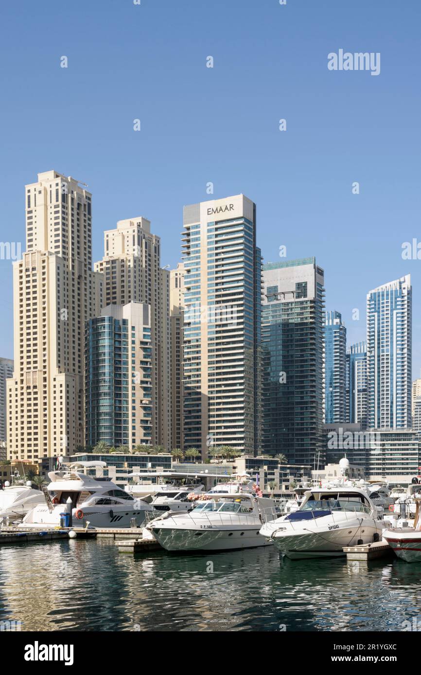 Dubai Marina is a man-made waterfront district with skyscrapers, luxury ...