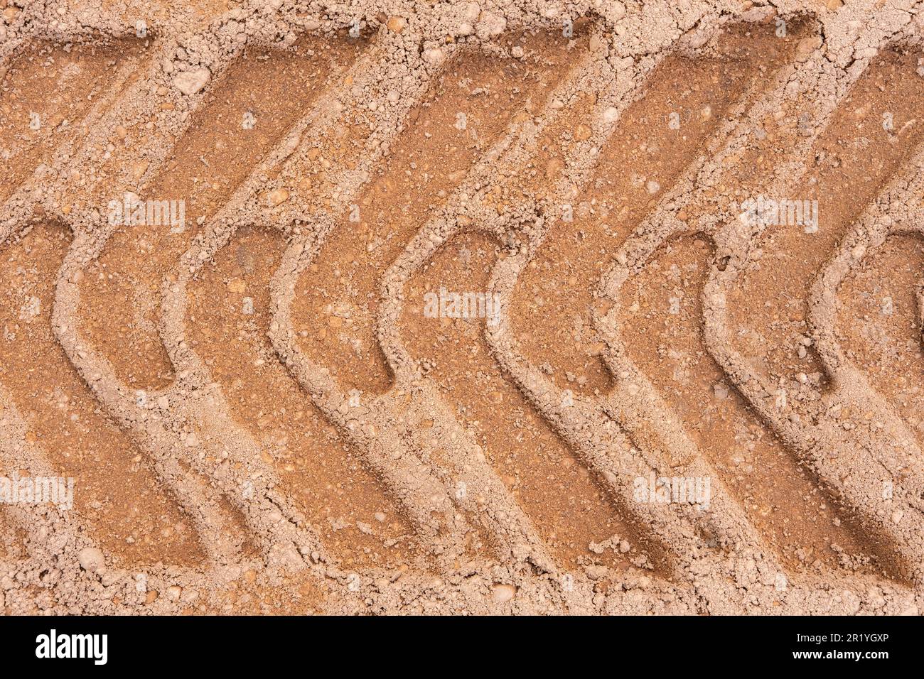 Footprint of car tire tread in a sand gravel road texture. Country road ...