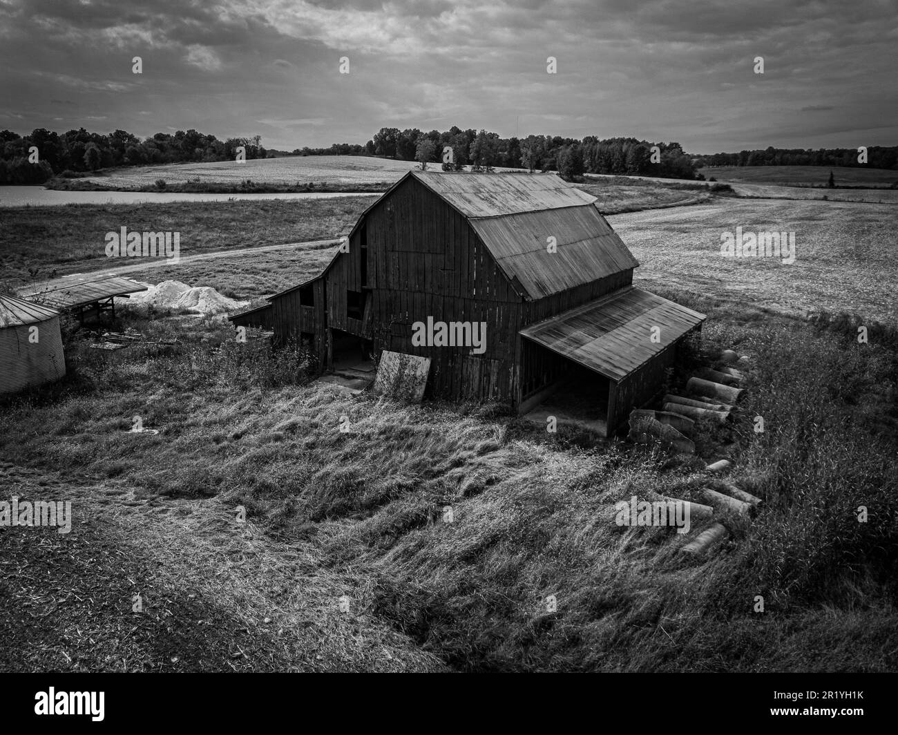 An aerial view of a weathered barn in the middle of a field Stock Photo ...