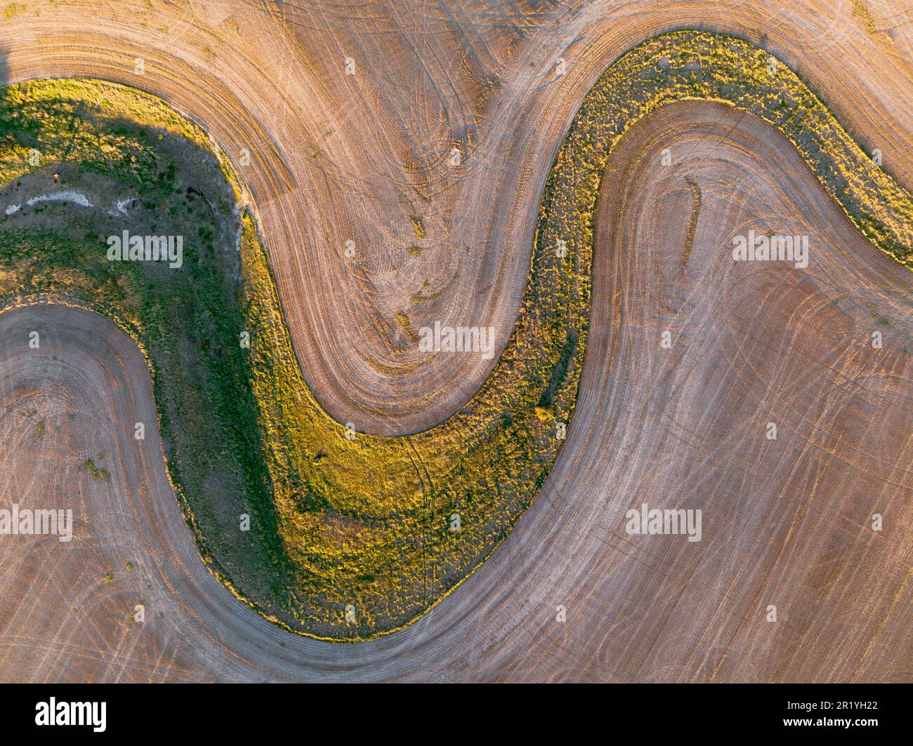 Aerial view of a green belt running through ploughed field ay Dimboola ...