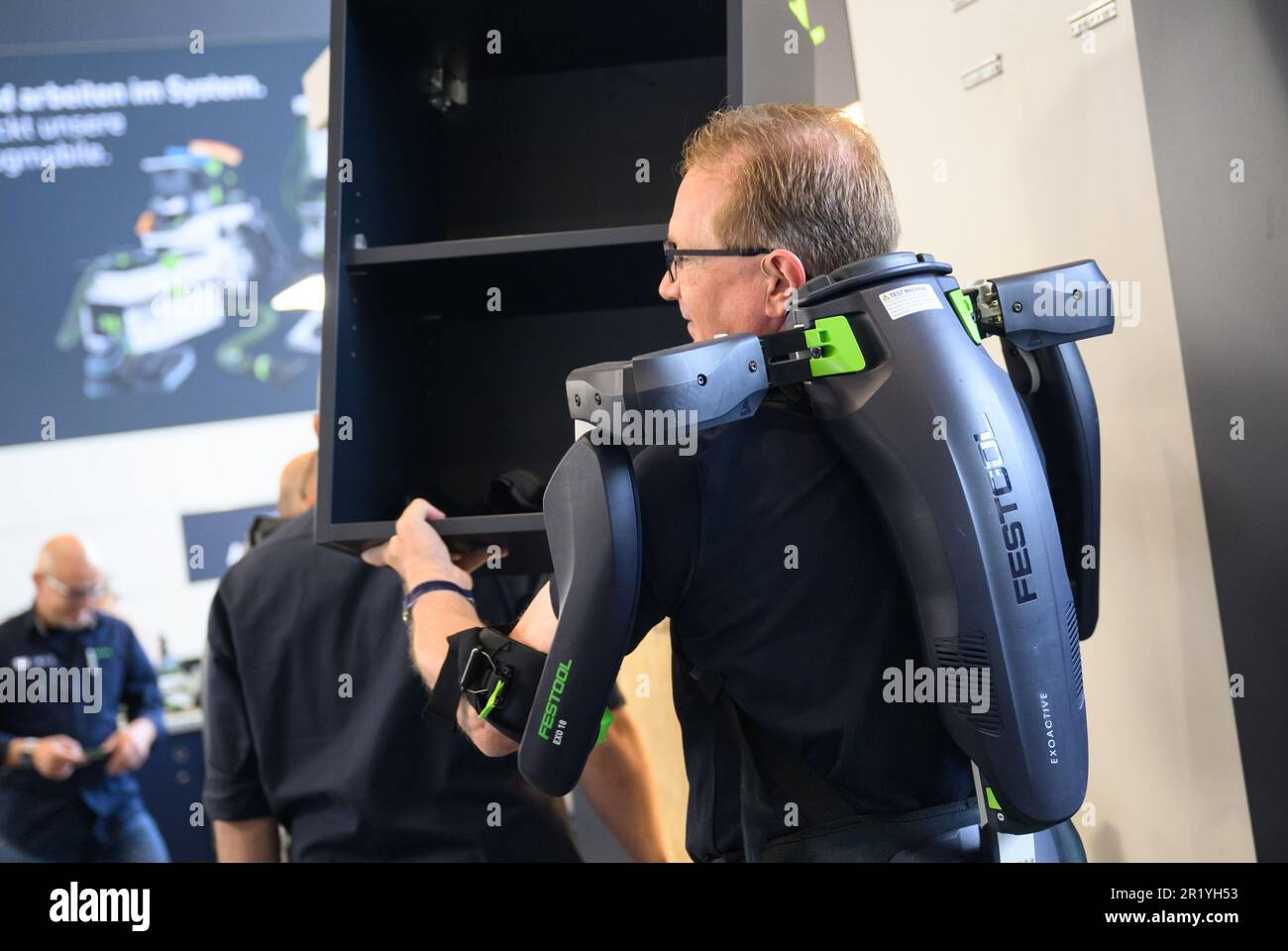 Hanover, Germany. 16th May, 2023. An employee holds a cabinet with the ...