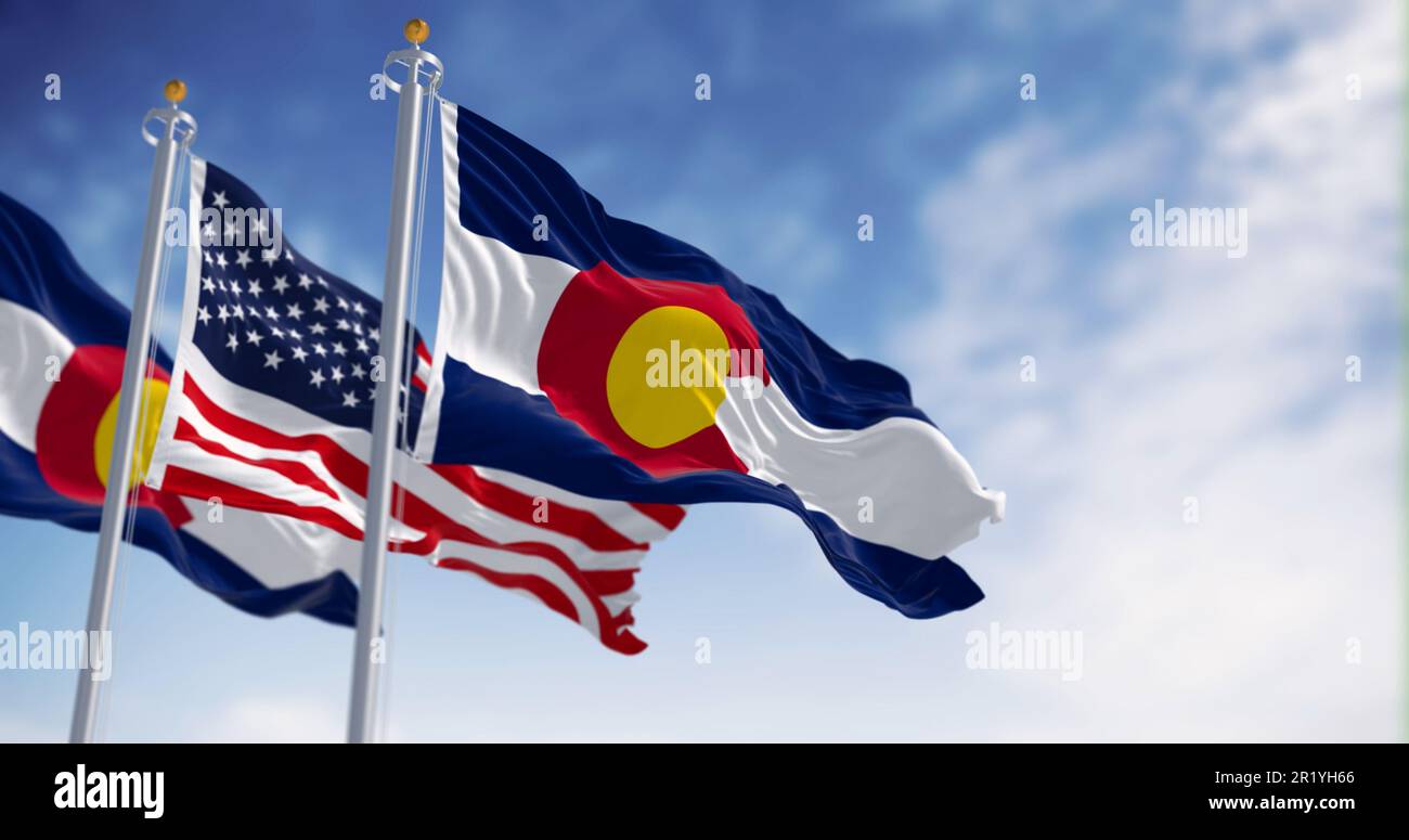 The Colorado state flag waving with the national flag of the United ...