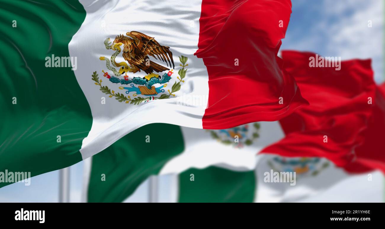 Three Mexican national flags waving in the wind. vertical tricolor of ...