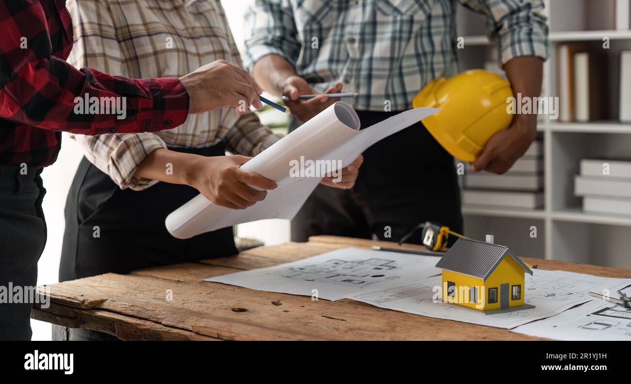 engineer working in office with blueprints, inspection in workplace for ...