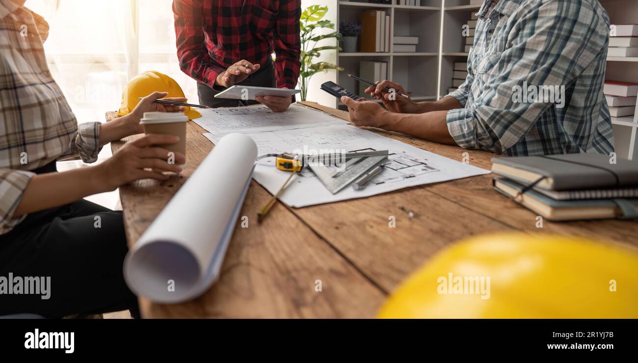 engineer working in office with blueprints, inspection in workplace for ...