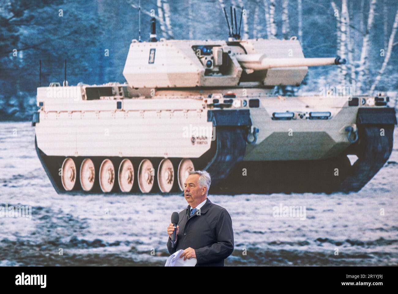 Munich, Germany. 16th May, 2023. Ralf Ketzel, CEO of the defense company KMW, speaks in front of ...