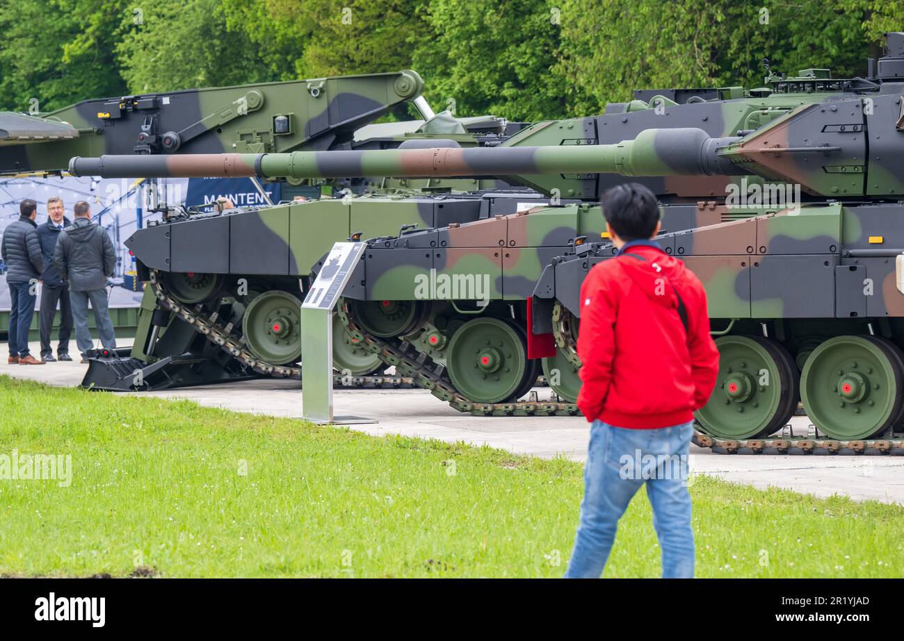 Munich, Germany. 16th May, 2023. Two Leopard 2 tracked tanks from defense contractor KMW stand ...