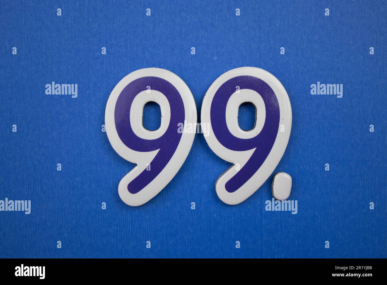 Placed on a blue background, photographed from above, 99. number of ...