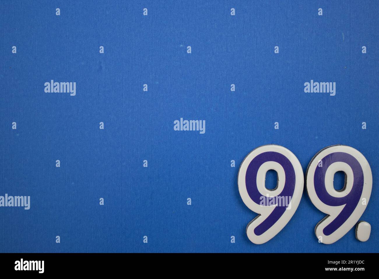 Placed on the edge of the blue background, photographed from above, 99 ...