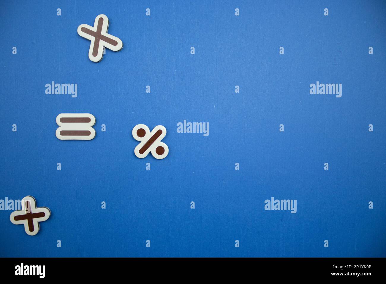 Math signs placed on the edge of the blue background Stock Photo - Alamy