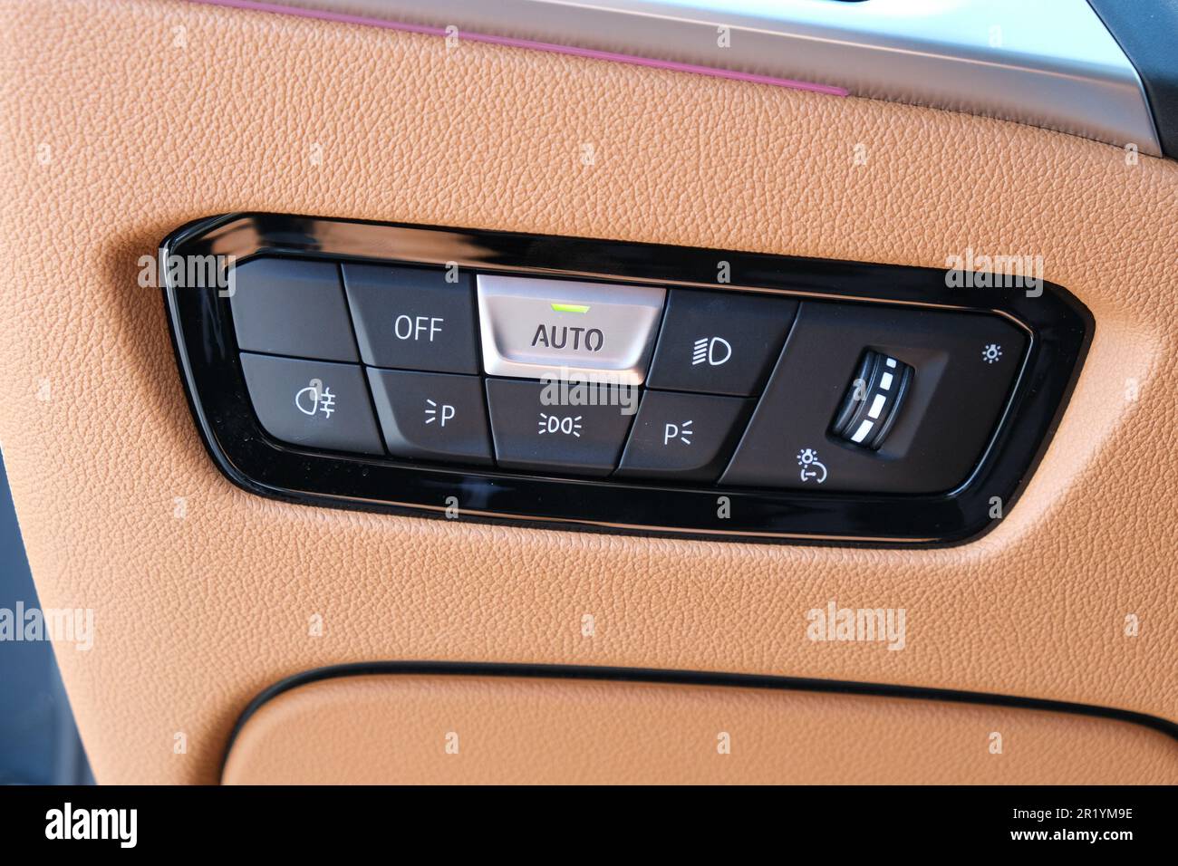 Close up car headlamp buttons dashboard inside of car. Selective focus ...