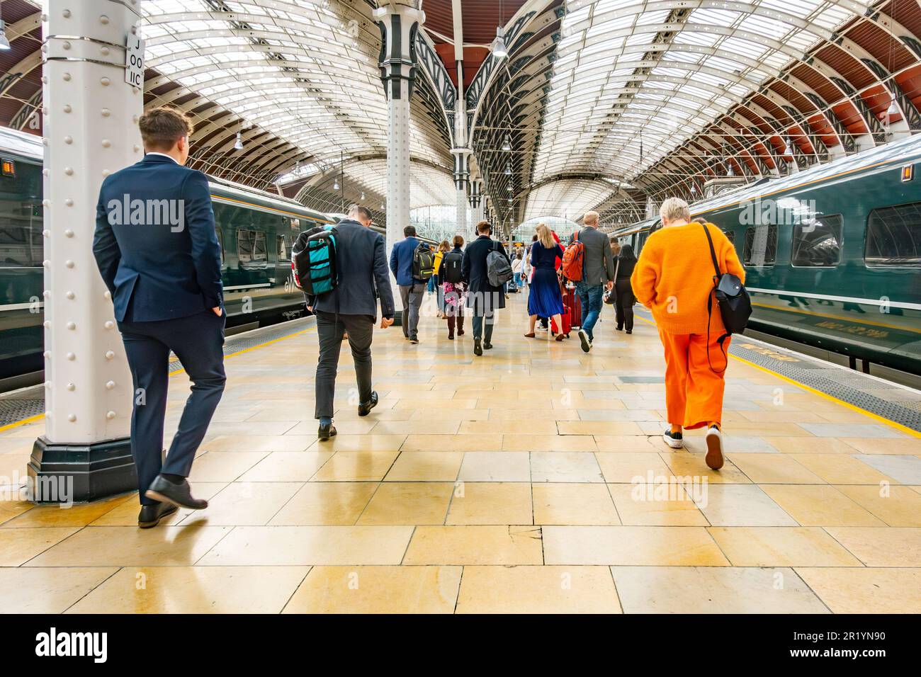 People walking along the platform having disembarked form a train at ...
