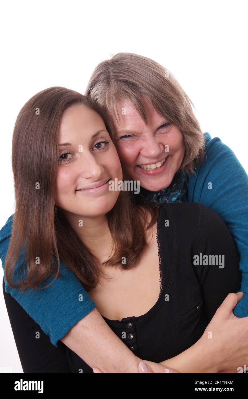 Mother embracing her pretty daughter Stock Photo - Alamy
