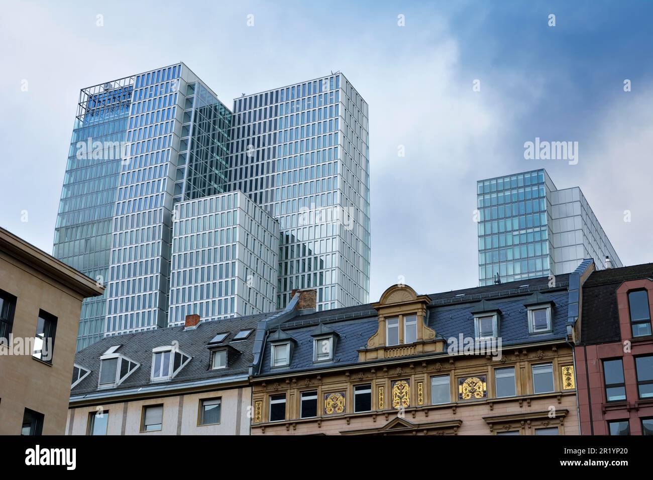 Modern office buildings behind old houses Stock Photo - Alamy