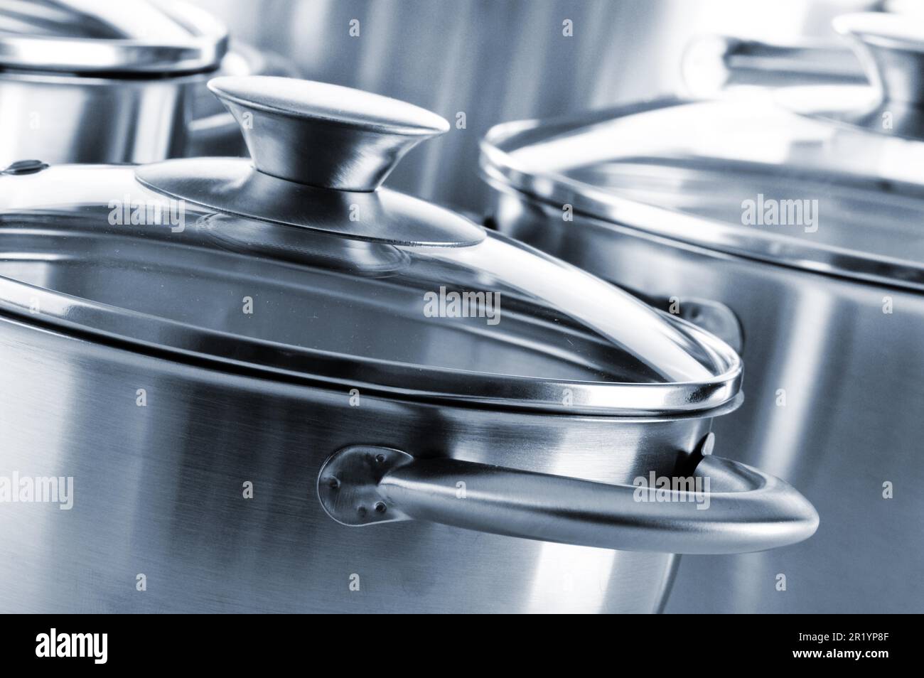 Composition with stainless pots Stock Photo - Alamy