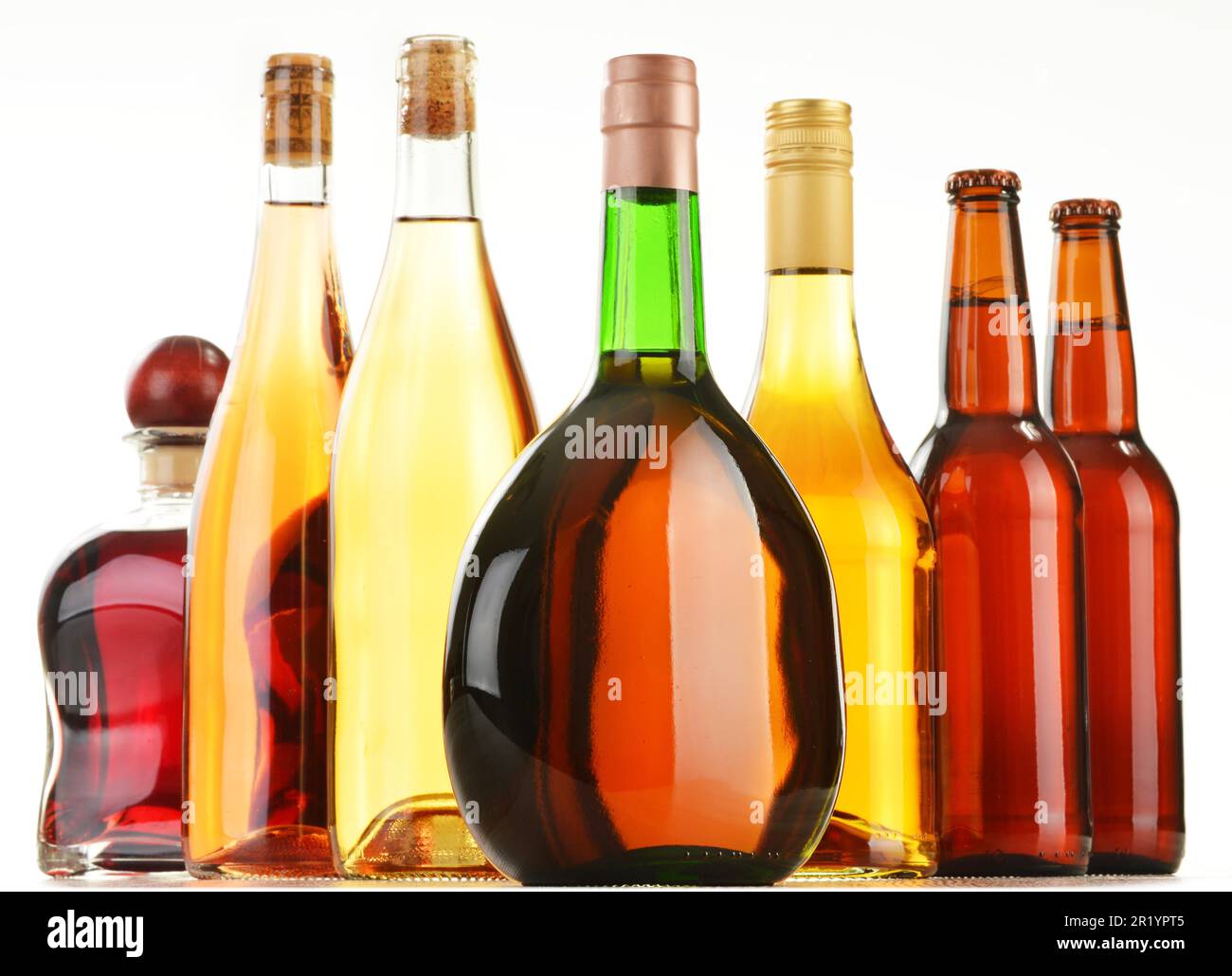 Bottles of assorted alcoholic beverages isolated on white background ...
