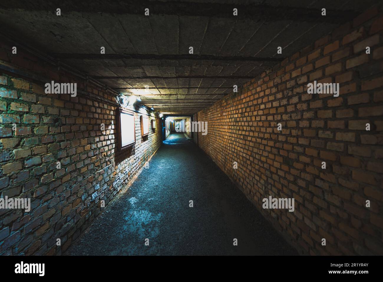 concrete underground tunnel with brick walls Stock Photo - Alamy