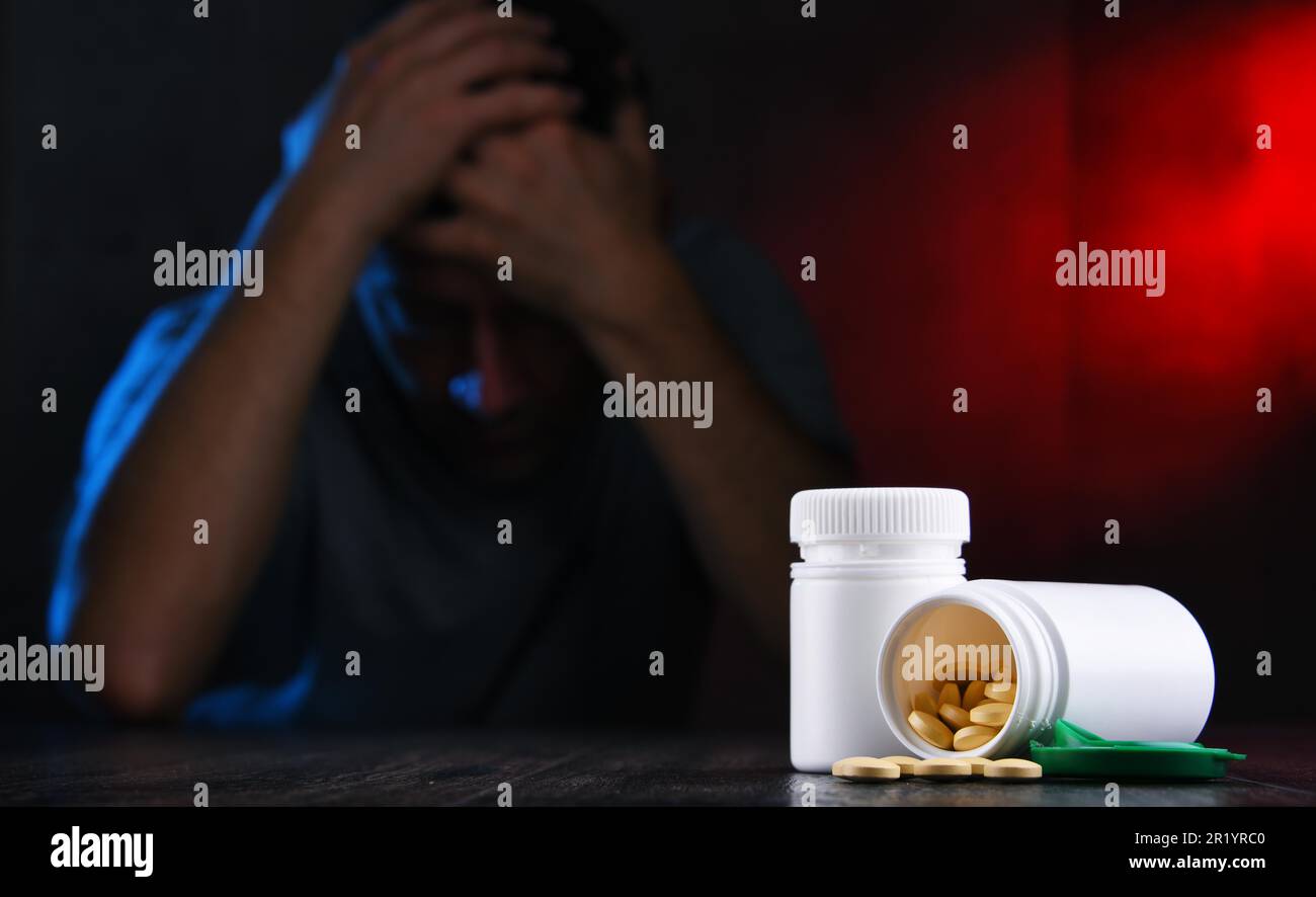 Drugs and the figure of a addicted man Stock Photo - Alamy