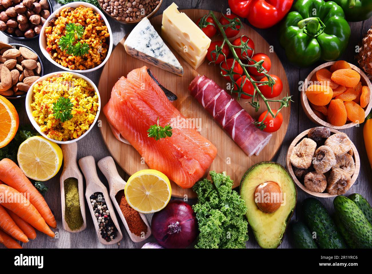 Composition with assorted food products on kitchen table Stock Photo ...