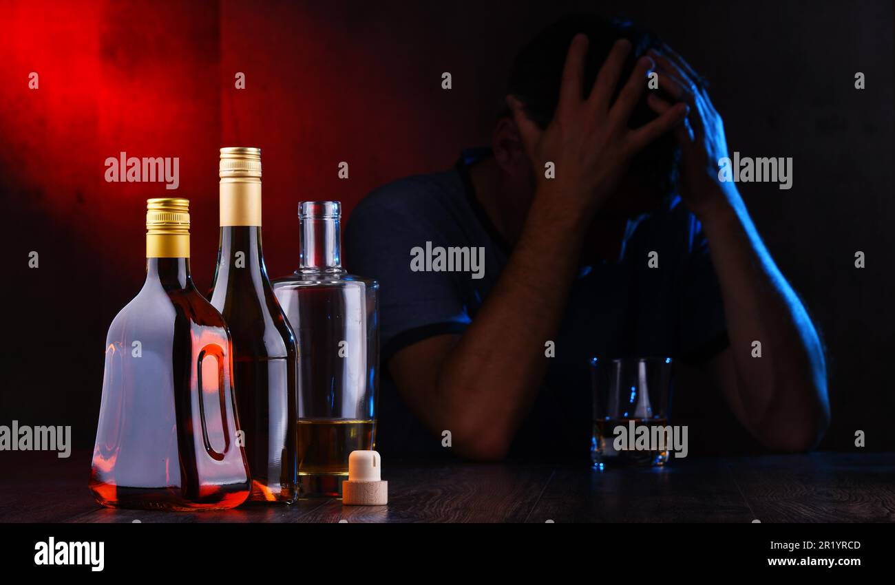 Bottles with alcoholic beverages and the figure of a drunk man Stock ...