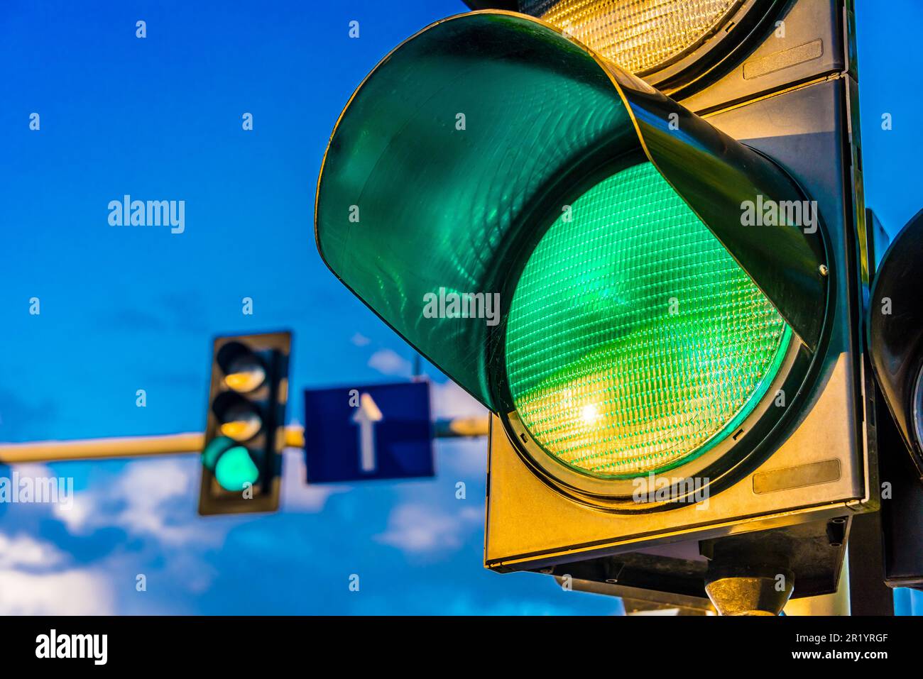 Traffic lights over urban intersection. Green light Stock Photo - Alamy