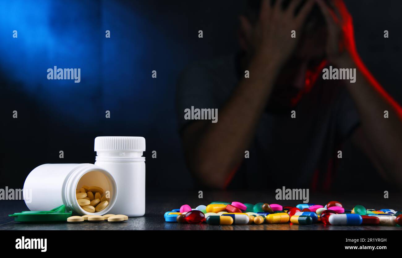 Drugs and the figure of a addicted man Stock Photo - Alamy