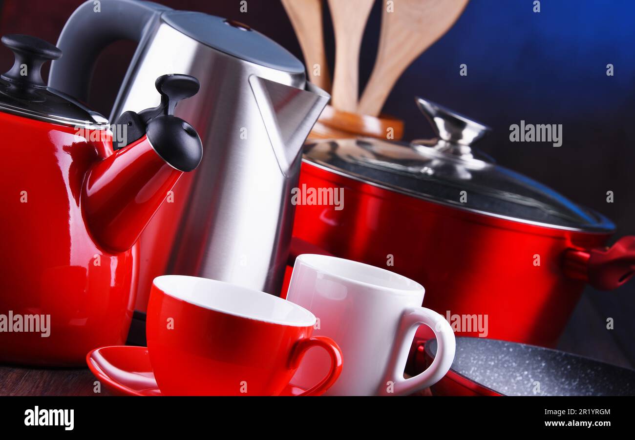 Composition with kitchen vessels, kettles and cups Stock Photo - Alamy