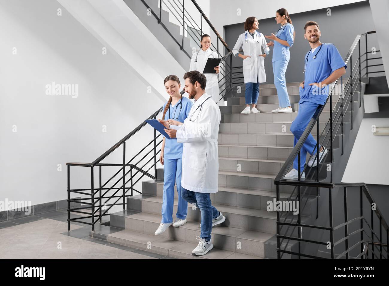 Medical students wearing uniforms on staircase in college Stock Photo ...