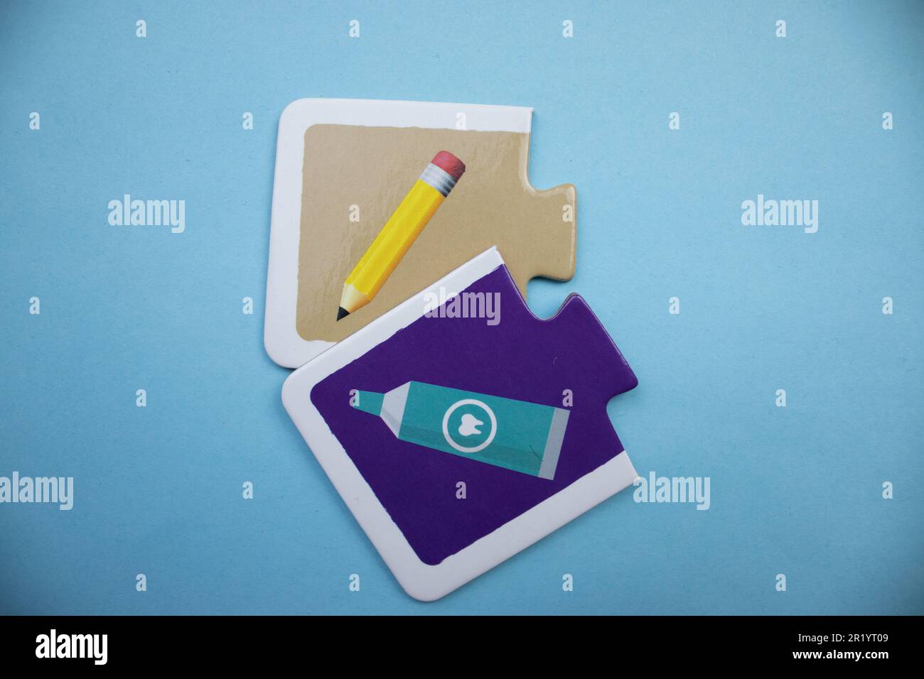 Information puzzle placed on a blue background. Toothpaste, pencil ...