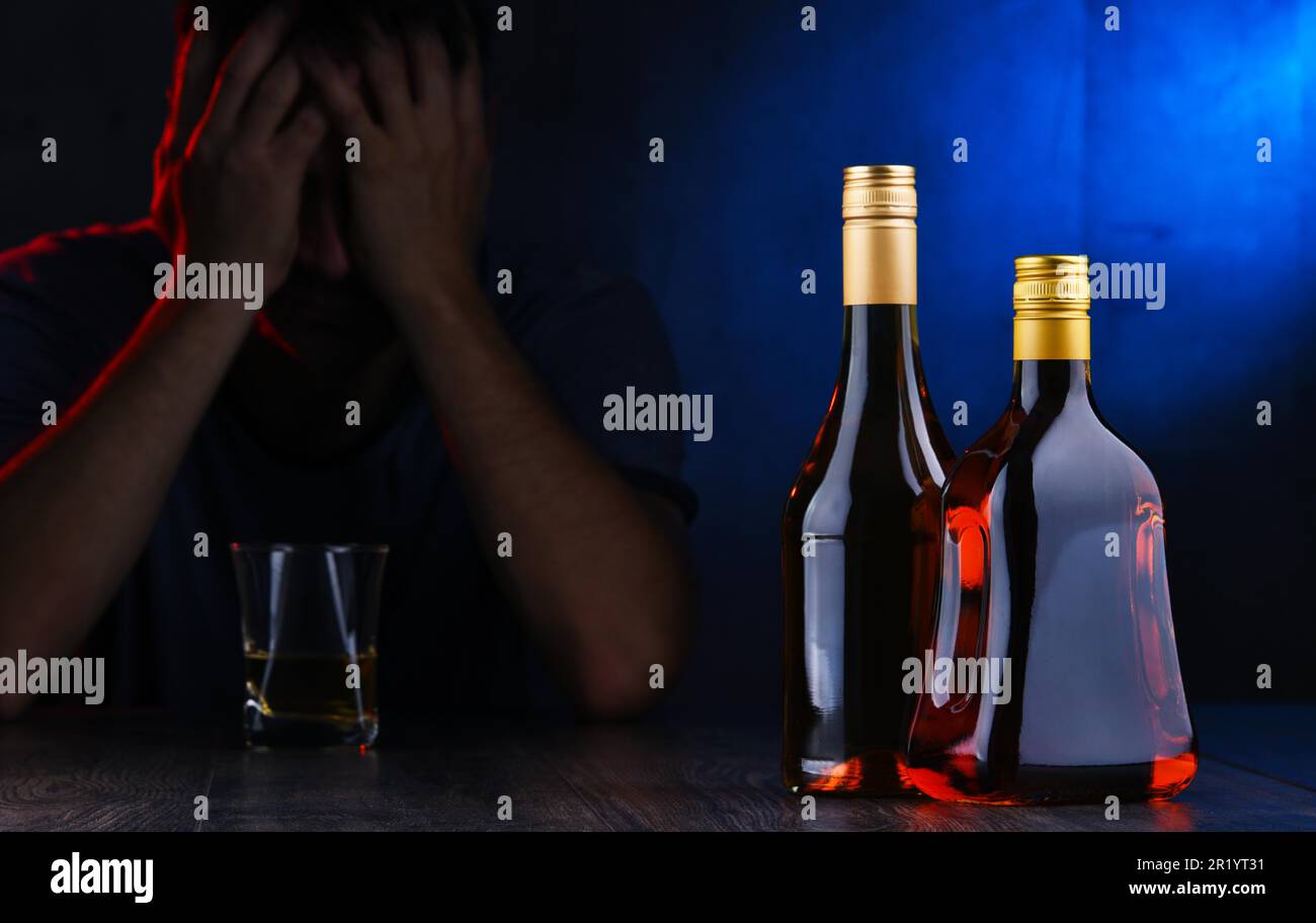 Bottles with alcoholic beverages and the figure of a drunk man Stock ...