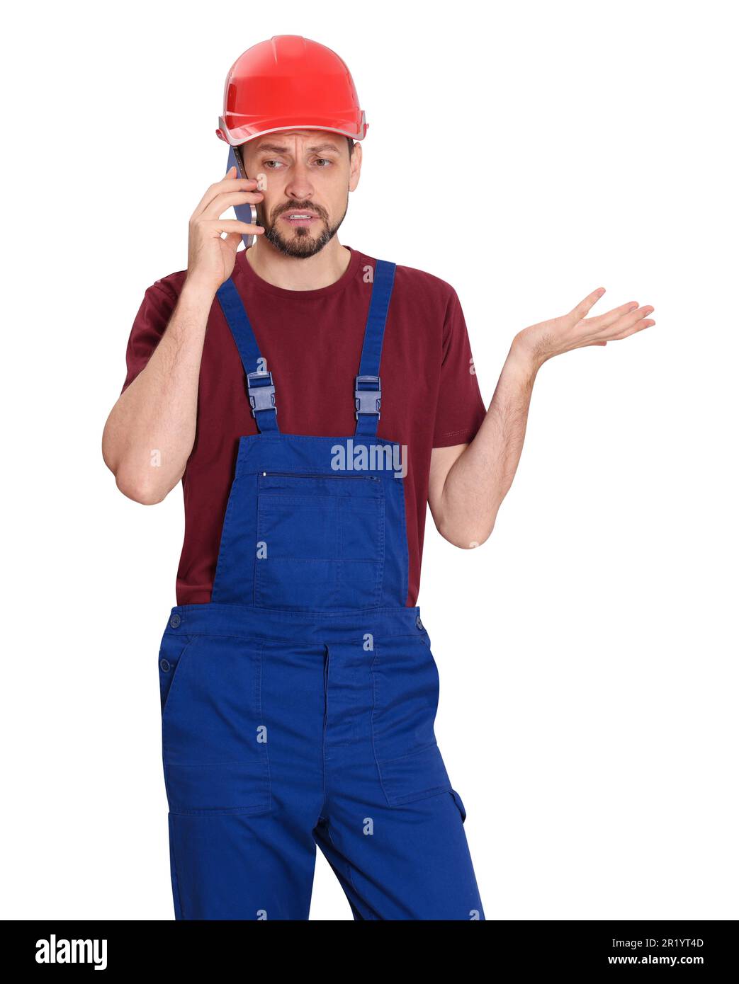 Professional repairman in uniform talking on phone against white ...