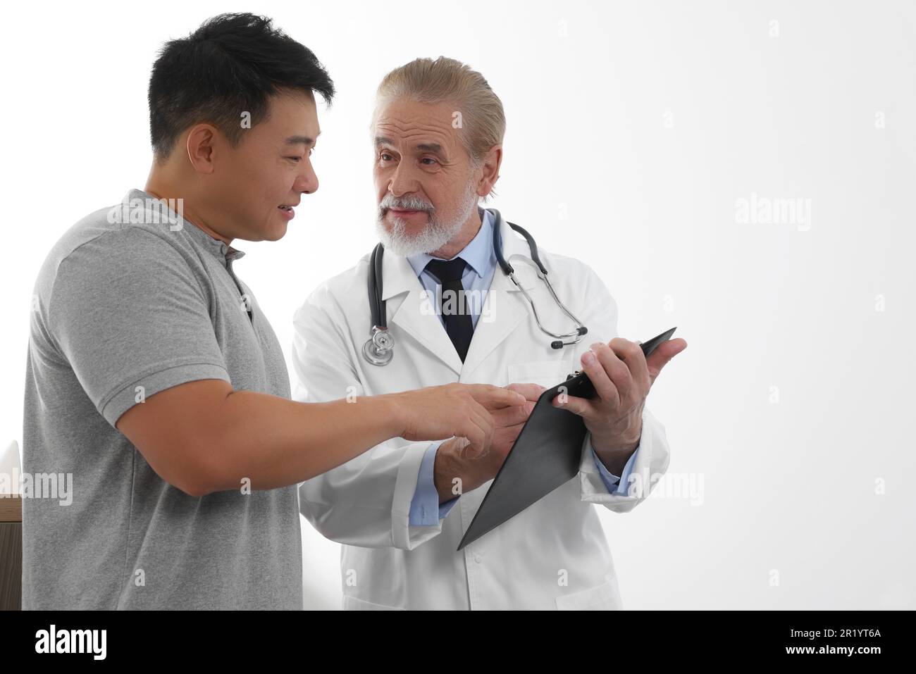 Patient having appointment with doctor on white background Stock Photo ...