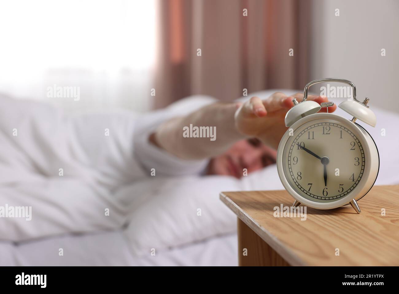 Man alarm clock switch off hi-res stock photography and images - Alamy