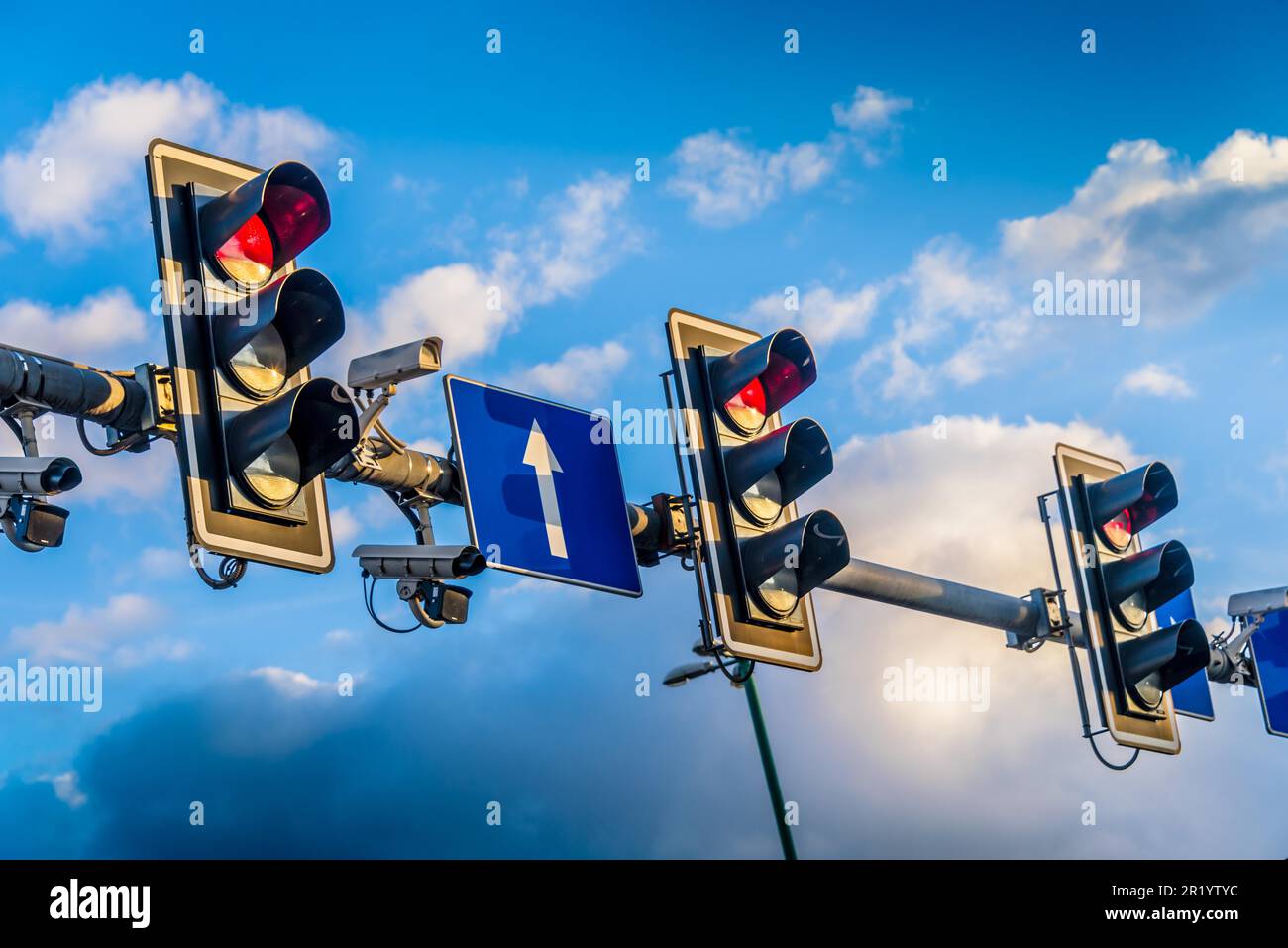 Traffic lights over urban intersection. Red light Stock Photo - Alamy