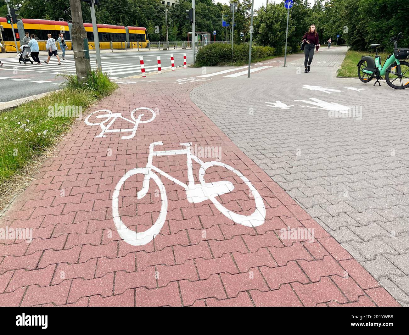 Street with road, pedestrian zone and red paved bicycle lane Stock ...
