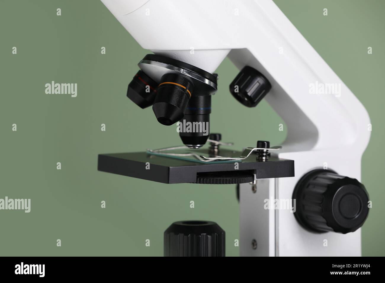 Modern microscope on green background, closeup. Medical equipment Stock ...