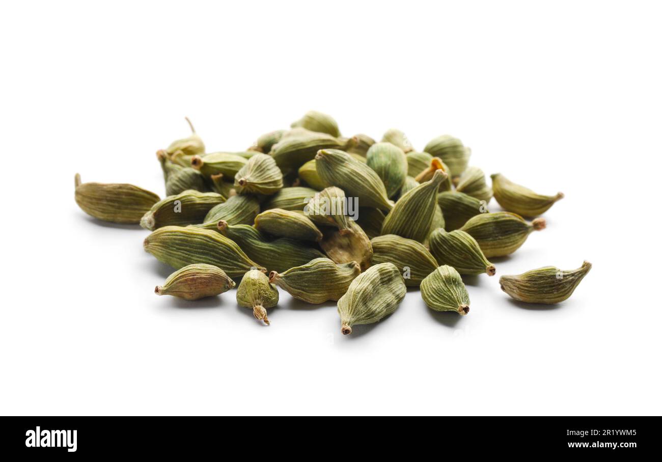 Pile of dry green cardamom pods on white background Stock Photo - Alamy