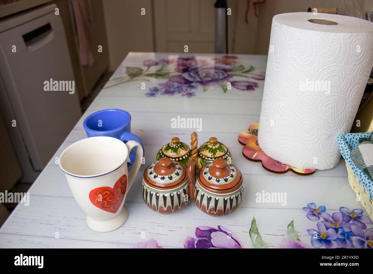 Spices and paper towels with traditional lines on the kitchen table ...