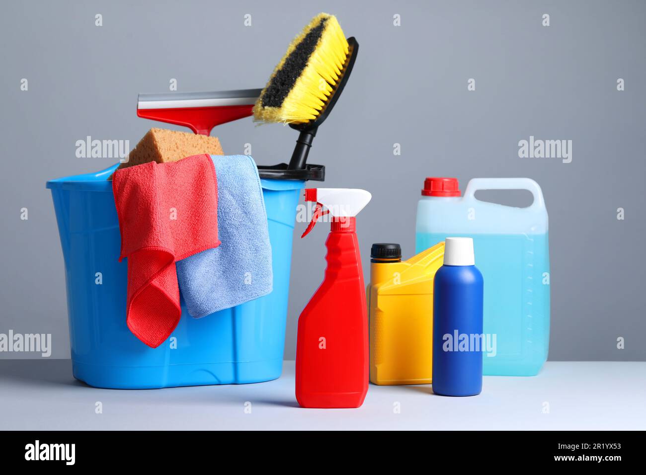 Different car products in bucket on white background Stock Photo - Alamy