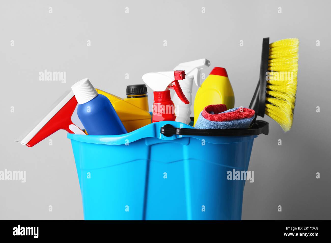 Different car products in bucket on white background Stock Photo - Alamy