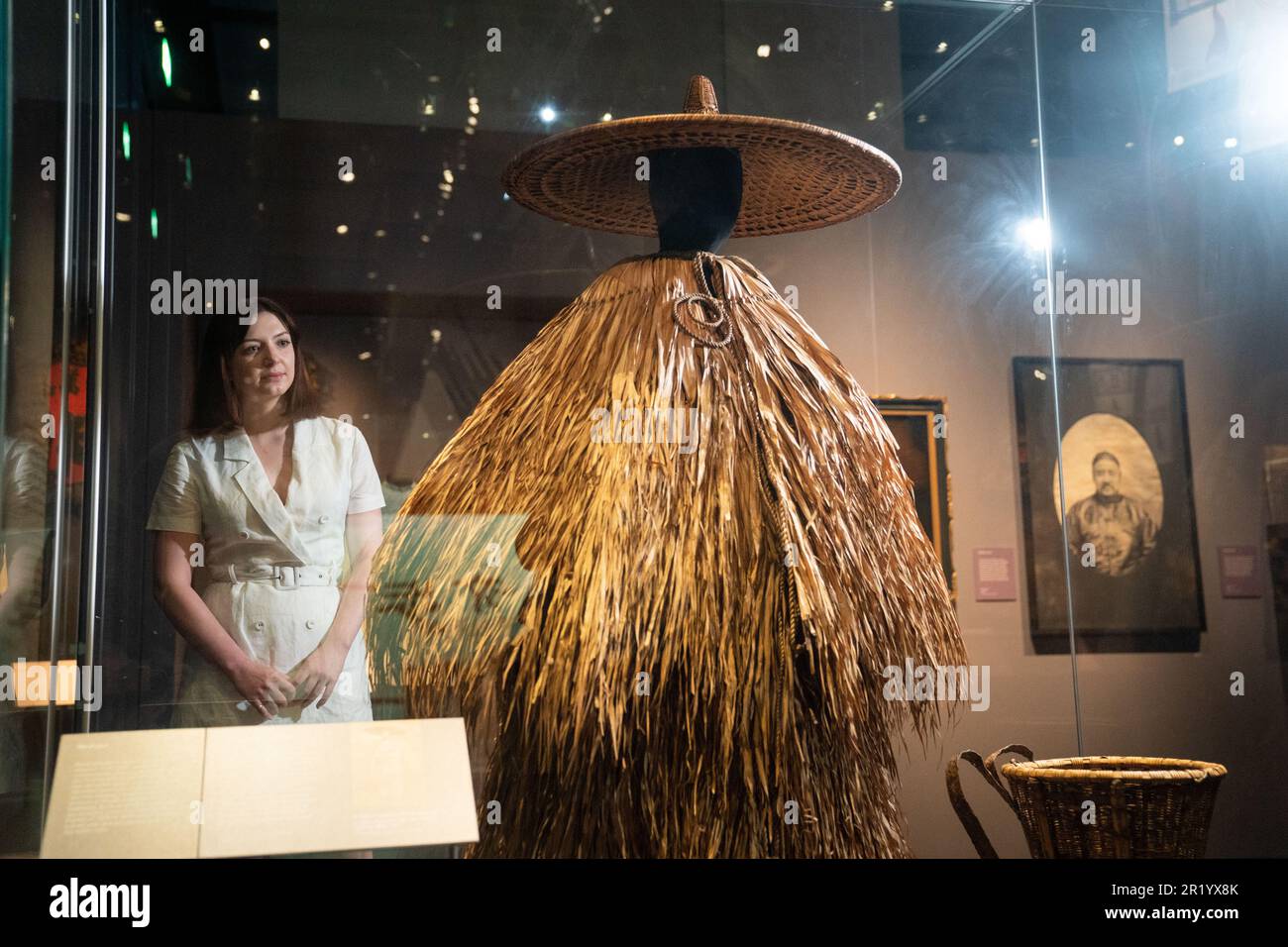 A British Museum worker looks at Waterproofs for a worker during a ...